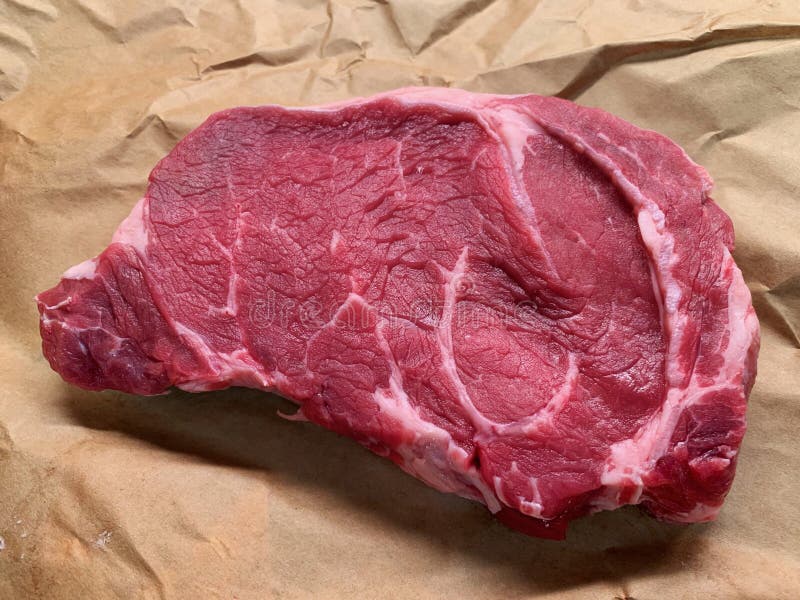 Beef Ribeye Steak Boneless Raw on Butcher Paper Stock Photo - Image of ...