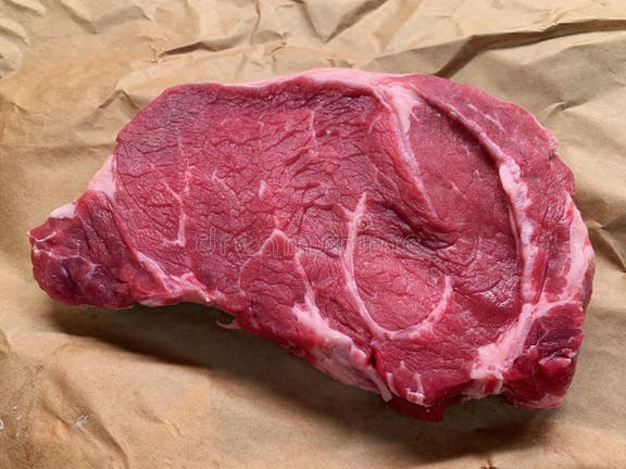 Beef Ribeye Steak Boneless Raw on Butcher Paper Stock Photo - Image of ...