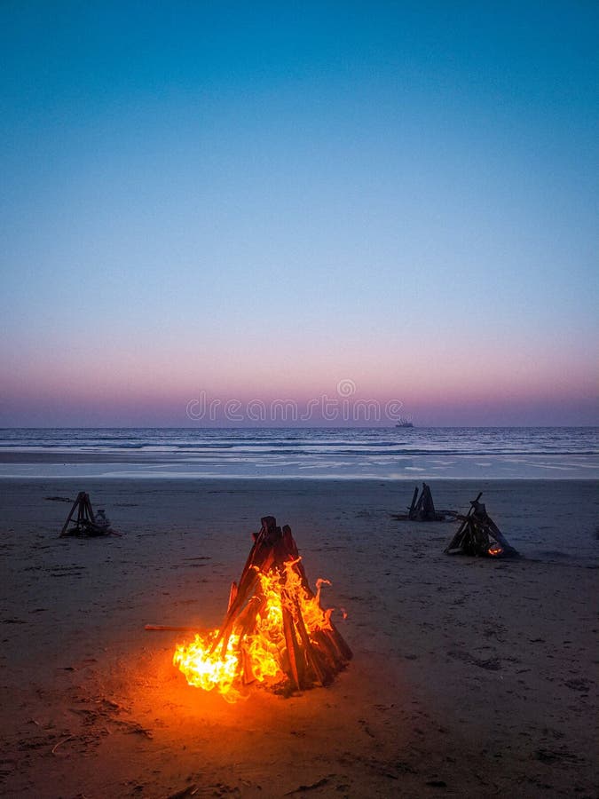 Bonfire on beach stock photo. Image of sunlight, coast - 190869172