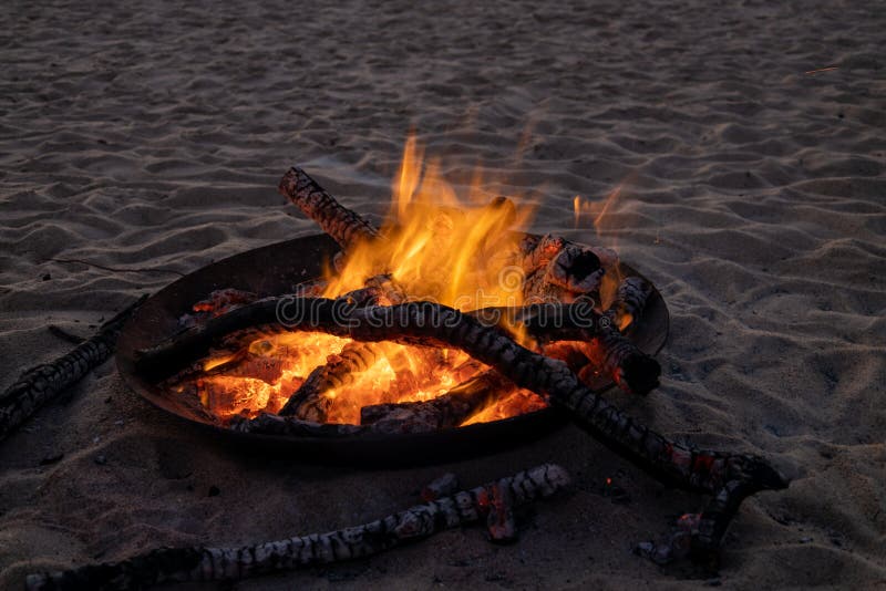 Bonfire on a Beach. Gathering by the Fire at Sunset Stock Image - Image ...