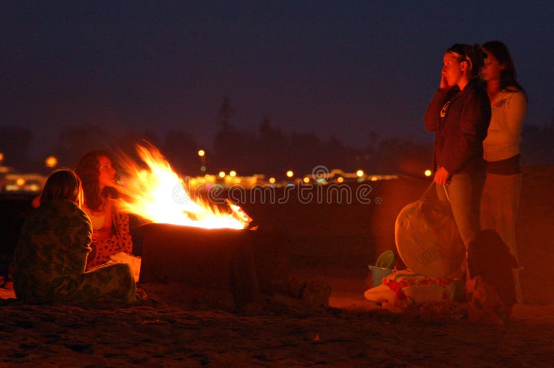 Bonfire at the beach editorial stock image. Image of family - 97488764