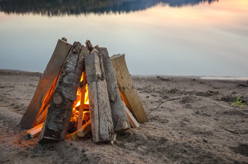 Bonfire on the beach sand stock photo. Image of fireplace - 54532576