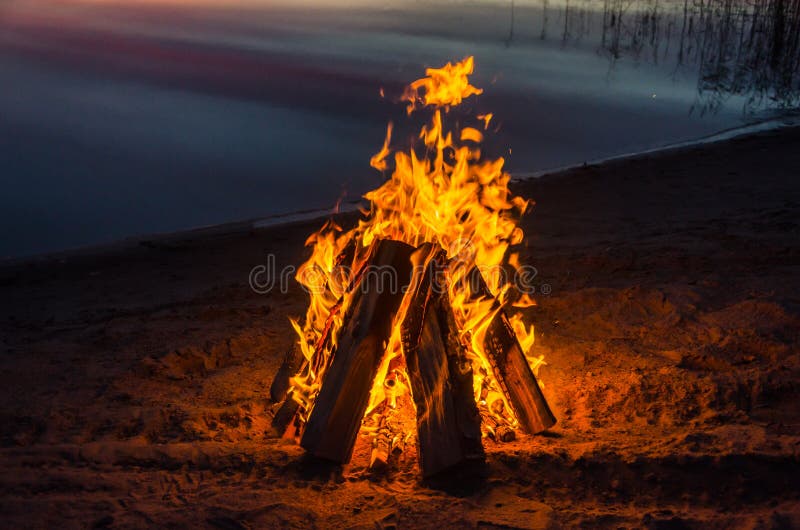 Bonfire on the beach sand stock photo. Image of fireplace - 54533230