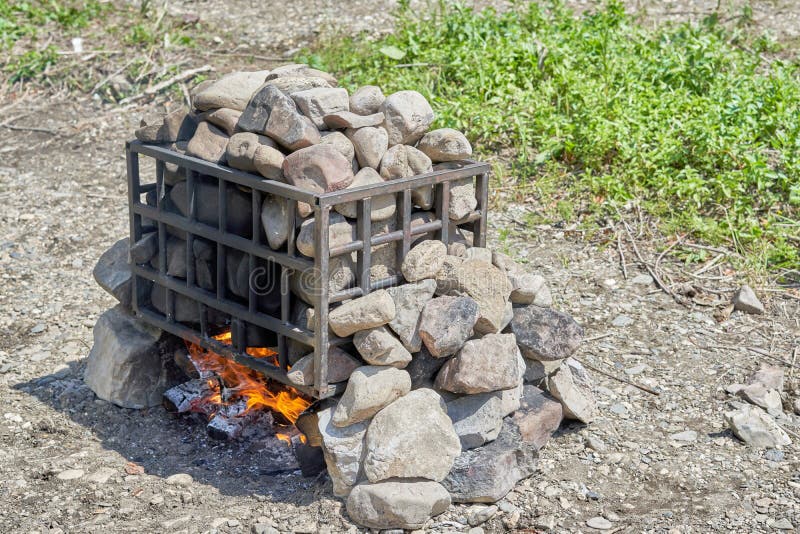 Bonfire Burning Under Rocks. Preparing a Camp Bath Stock Image - Image ...