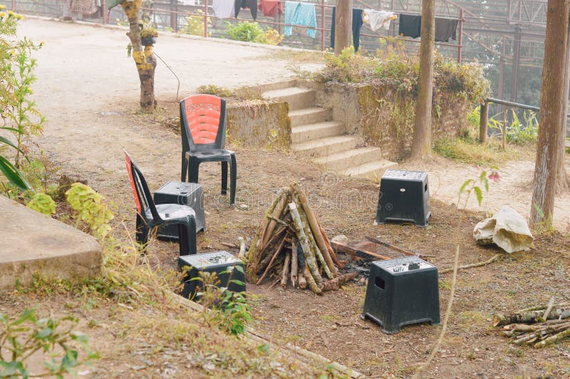A Bonfire at a Camping Site of a Tourist Resort. Empty Plastic Chairs ...