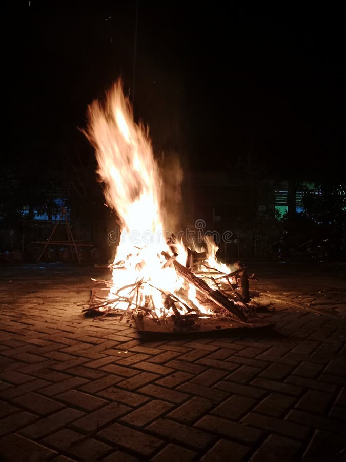 Bonfire lighting at night stock photo. Image of night - 264386638