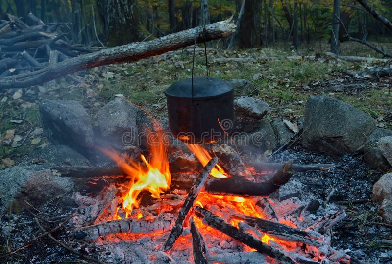 Bonfire and pot 3 stock image. Image of taiga, camp, blaze - 34697407