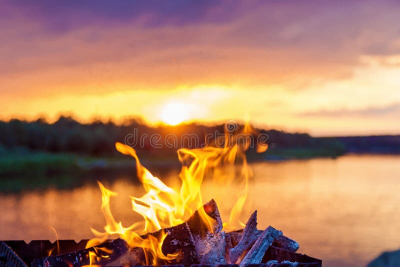 Bonfire by the River at Sunset Stock Image - Image of fireplace, glow ...