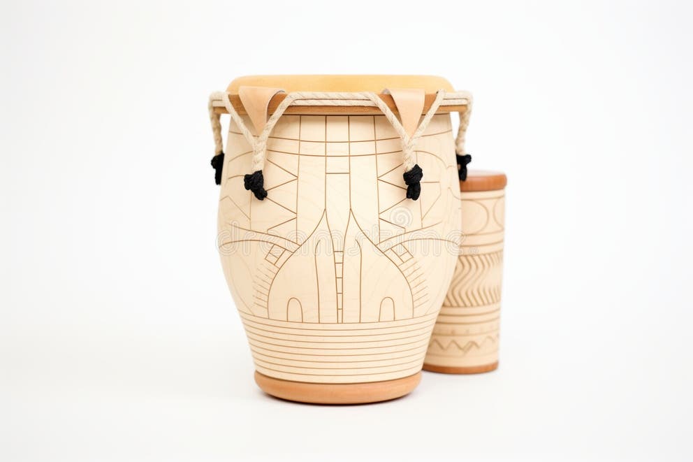 A Bongo Drum Set with Engraved Patterns, on a White Surface Stock Photo ...