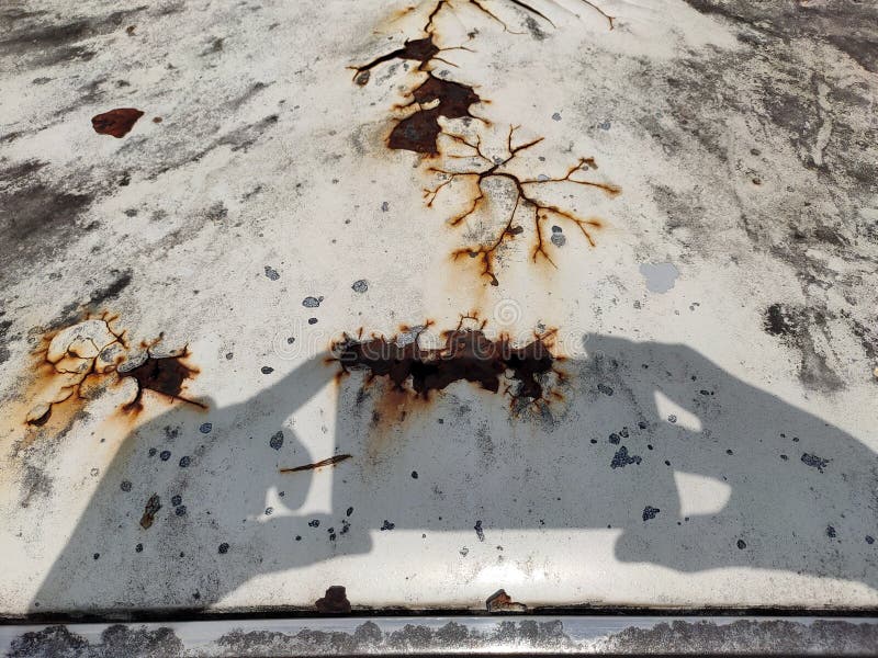 The Bonnet of the Damaged Surface of an Old Car that is Parked in the ...