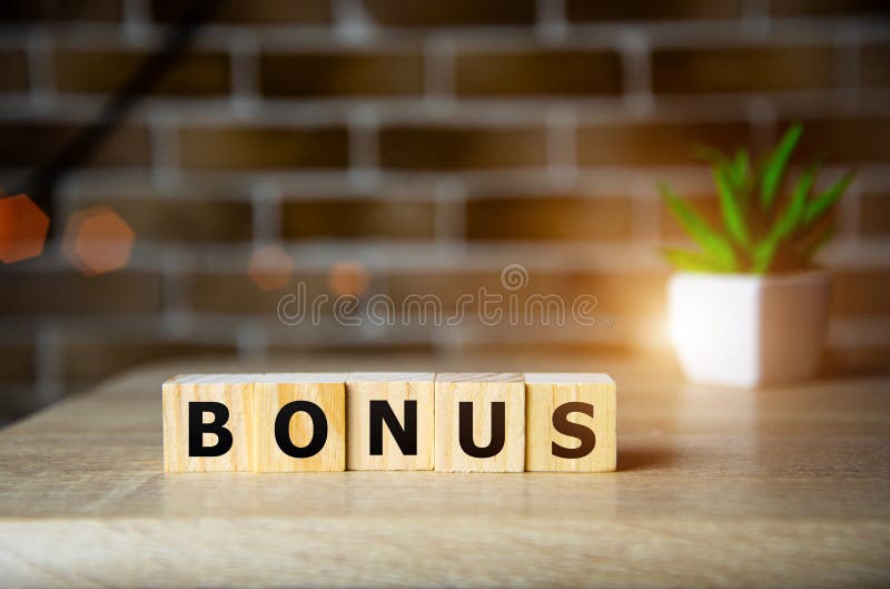 BONUS Word Made with Building Blocks on Brick Background Stock Photo ...