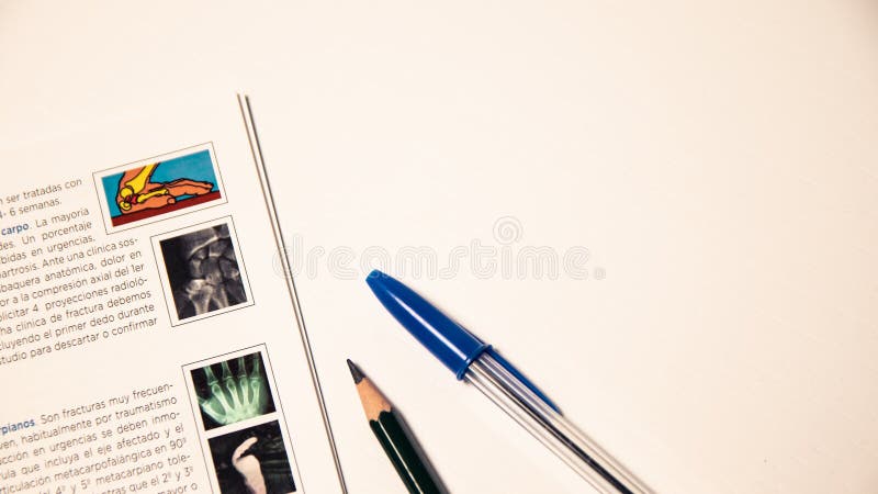 A Book with a Blue Pen Next To it and a Pen with Space for Text. Space ...