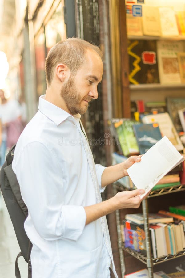 Book browsing stock image. Image of europe, adult, backpack - 67091861