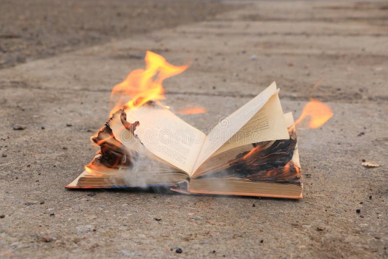 Book with Burning Pages on a Concrete Surface Stock Image - Image of ...