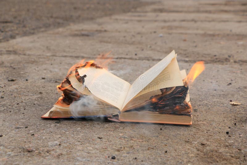 Book with Burning Pages on a Concrete Surface Stock Image - Image of ...
