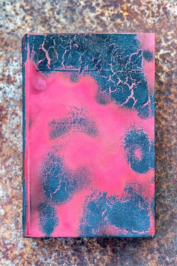 A Book with a Burnt Cover on a Metal Surface Stock Photo - Image of ...
