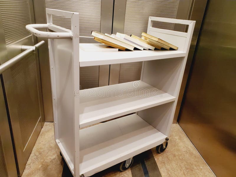 Book cart in elevator stock photo. Image of shelf, wall - 215529404