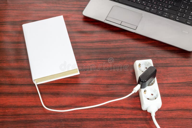 Book Connected To a Power Outlet. Stock Image - Image of hardcover ...
