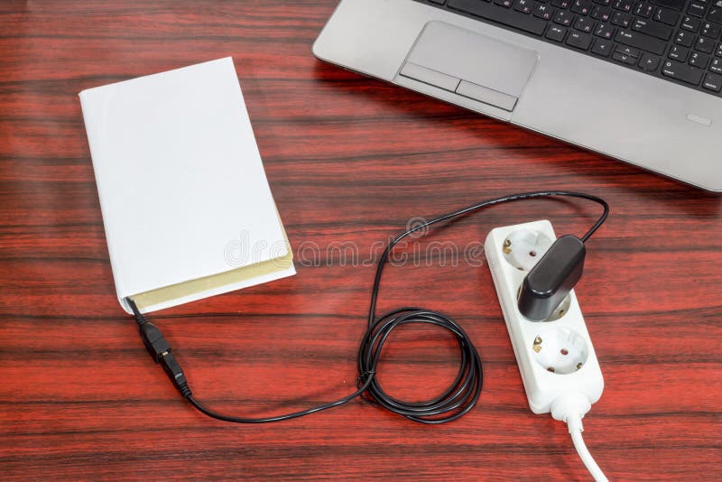 Book Connected To a Power Outlet. Stock Image - Image of office ...