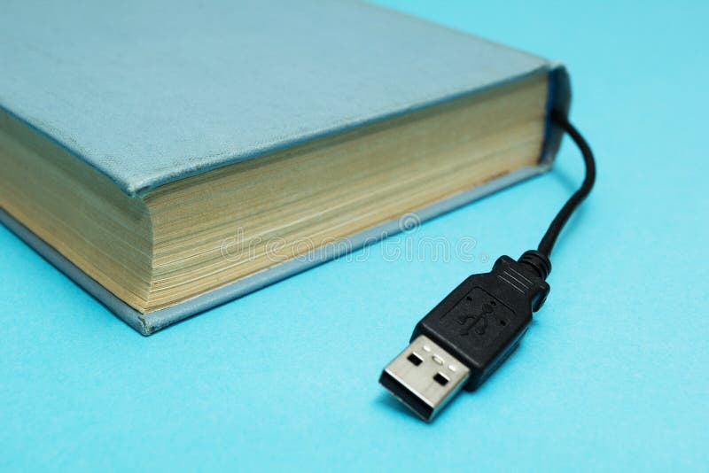 Book with a Connector for Connection To a Computer on a Blue Background ...