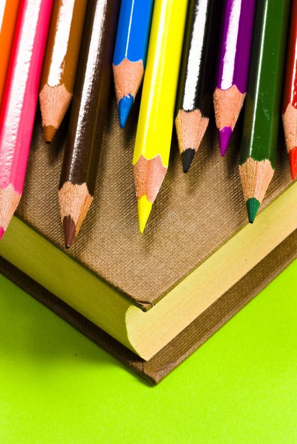 Stacks of Colorful Books and Socket with Felt Pens Stock Image - Image ...