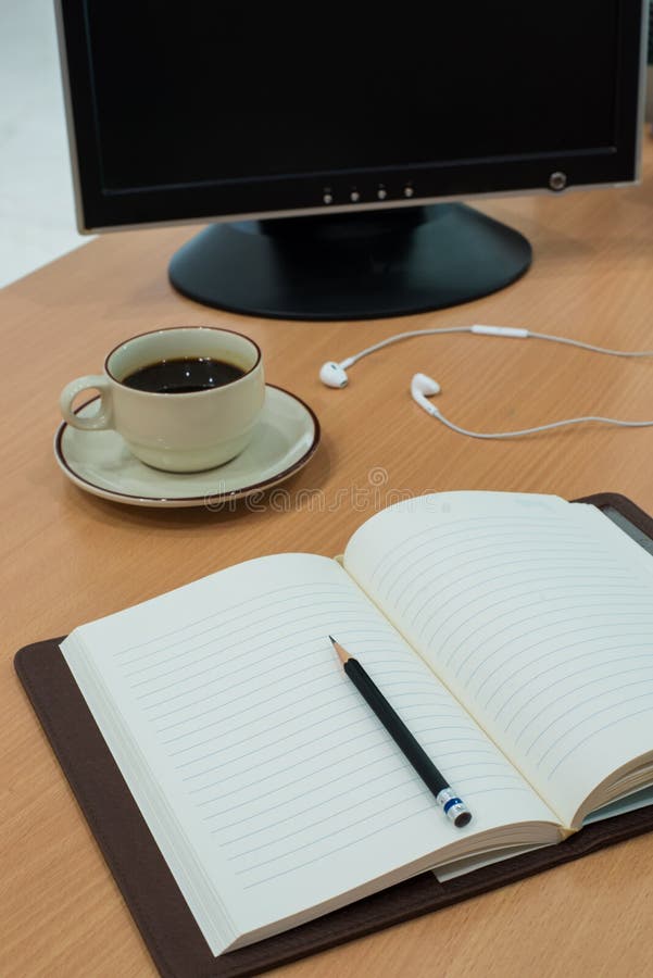Notebook,earphone,coffee and Computer on Wooden Table Stock Image ...