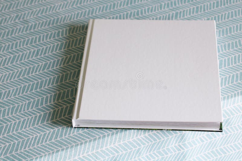 Book with an Empty White Cover on a Blue Tablecloth, Mockup, Copy Space ...