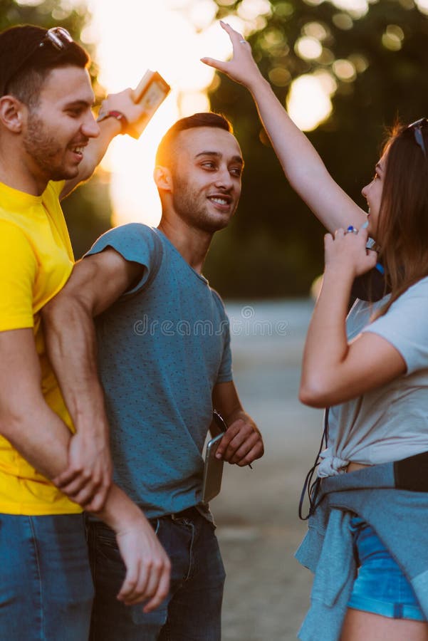 Friends Having Fun in a City Park on a Sunny Autumn Day. they Enjoy ...