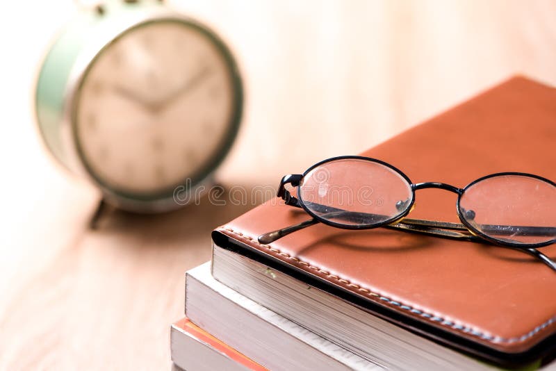 Book and Glasses on Wood Table Stock Image - Image of wooden, education ...