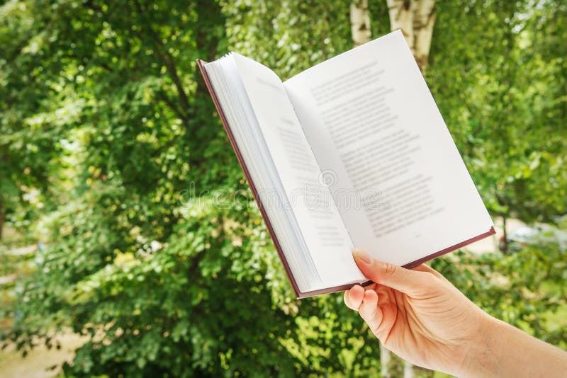 Book in hand stock photo. Image of student, paper, white - 96782008