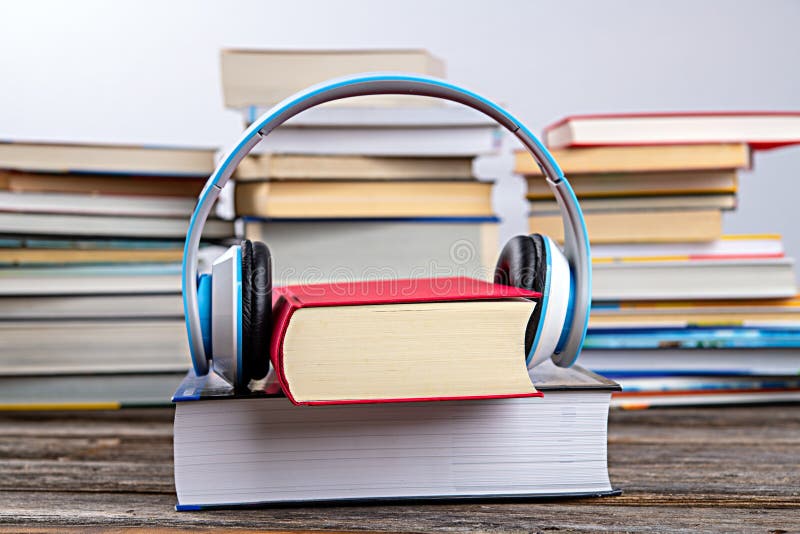 Book with Headphone in Front of Piles of Different Books Stock Image ...