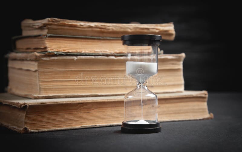 Book and Hourglass on the Black Table Stock Photo - Image of book ...