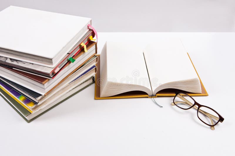 Open Book and School Supplies with a Path on a White Background. Stock ...