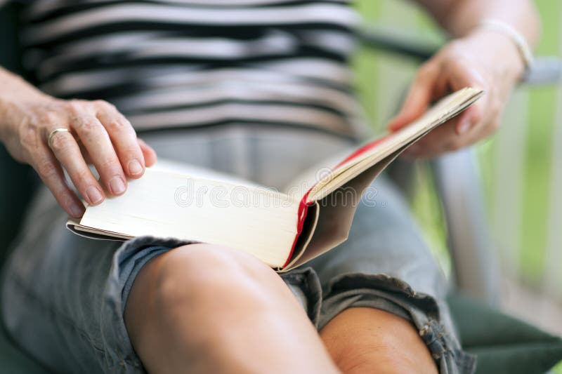 Book in lap stock image. Image of lying, sweater, person - 19769049