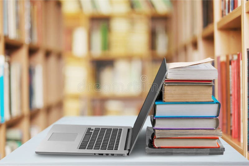Stack of book and laptop stock photo. Image of mobility - 13762502