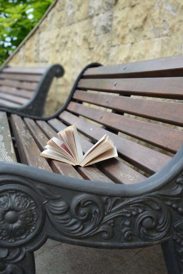Book Left on a Park Bench (vertical Shape) Stock Photo - Image of paper ...