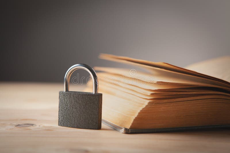 Book and Lock on a Wooden Table Stock Photo - Image of literature, lock ...