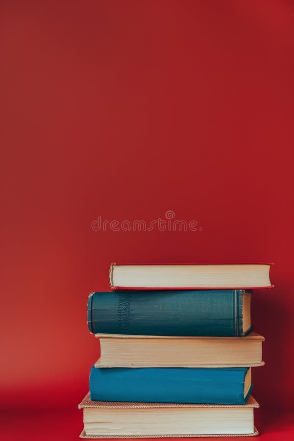 Book Lovers Day. Stack of Books with Red Covers Against a Bright Red ...