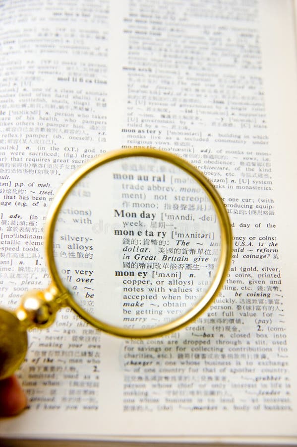 Book with a magnifier lens stock image. Image of money - 22462555