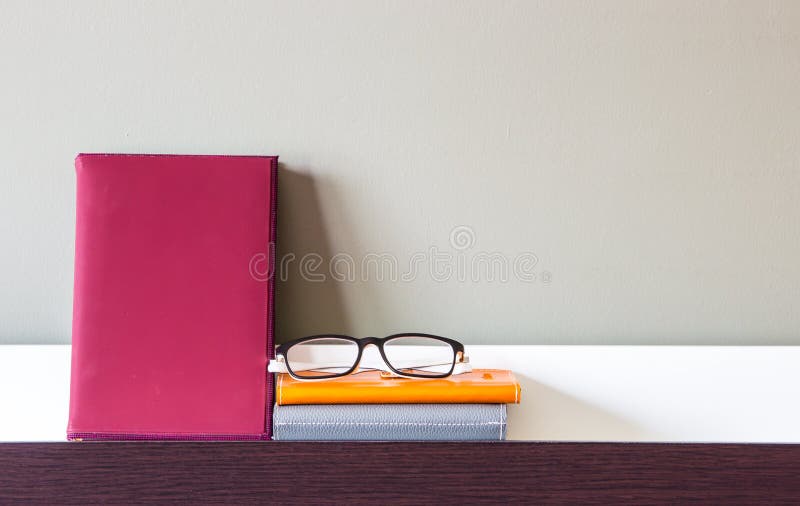 Book, Notebooks and Glasses on Shelf Stock Photo - Image of book ...