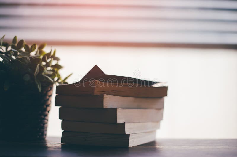 Book is Overlaid on the Top of the Table. Reading Concept Stock Photo ...