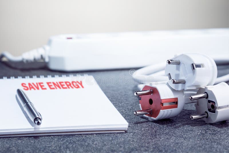 Book Page, with Hand Writing SAVE ENERGY and Electric Plugs on the ...