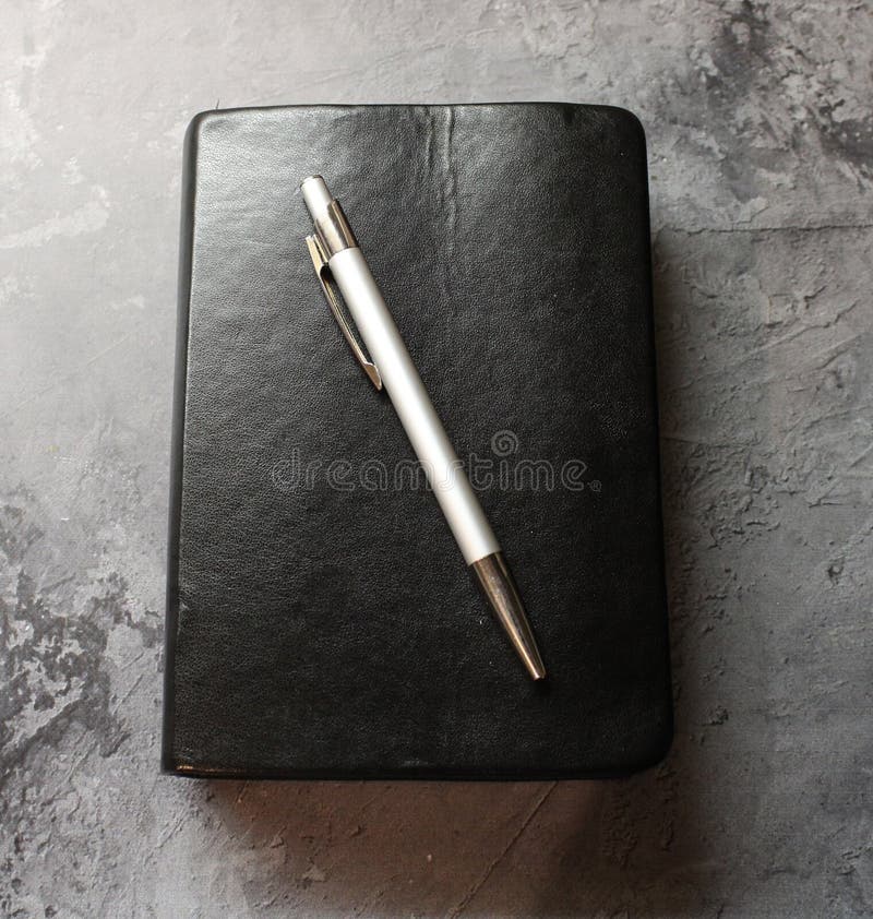A book and a pen stock photo. Image of leather, drawing - 140813572