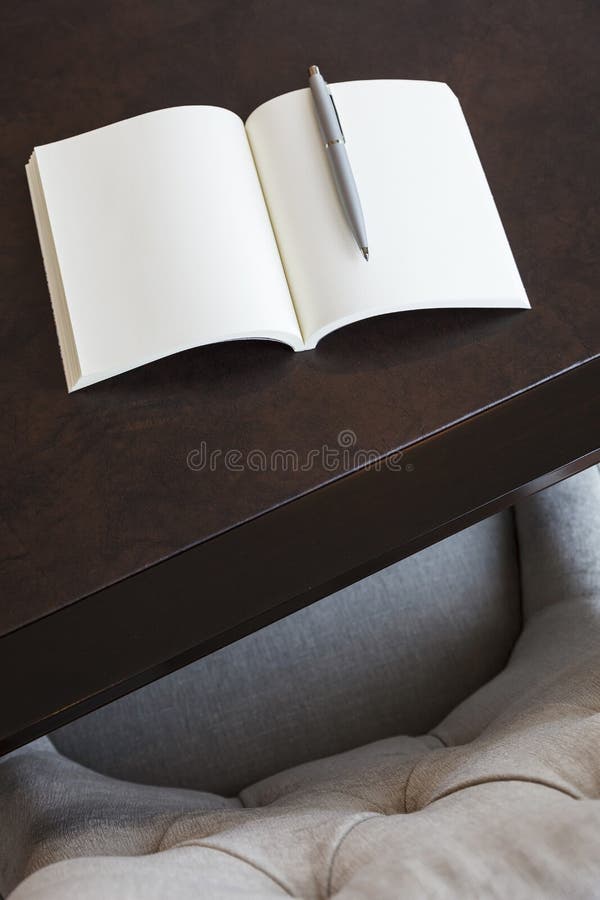 Book with pen on desk stock photo. Image of home, strat - 45626950