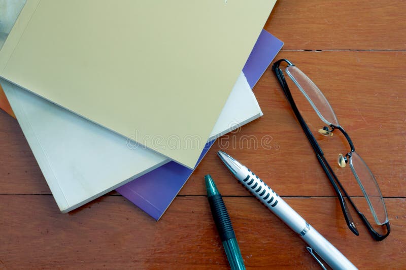 Book Pen and Glasses on Red Wood Table Stock Photo - Image of school ...