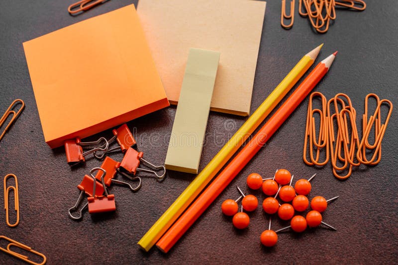 The Book, Pencil, Paper Clips And Sheets For Marks Lie On A Desktop ...