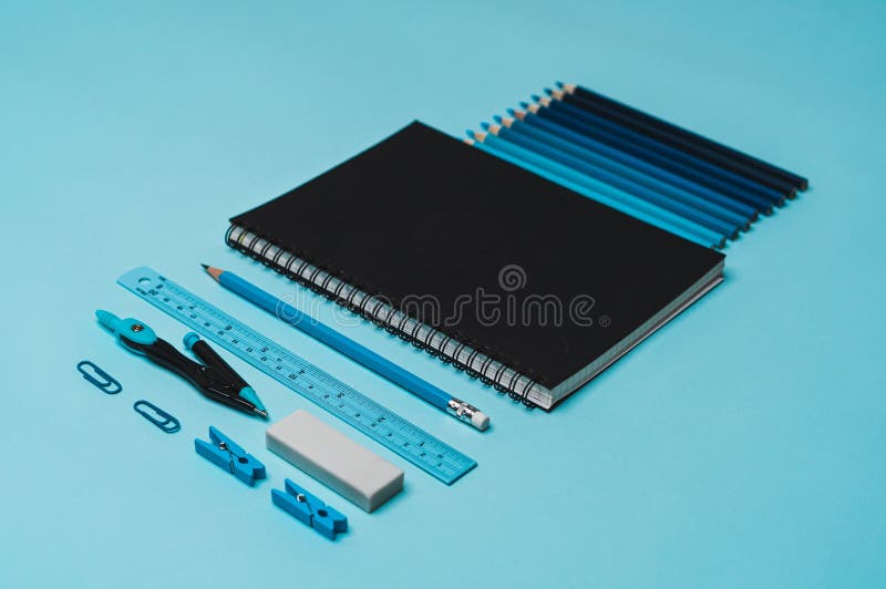 Book, Pencil, Ruler on a Blue Background Stock Image - Image of ...