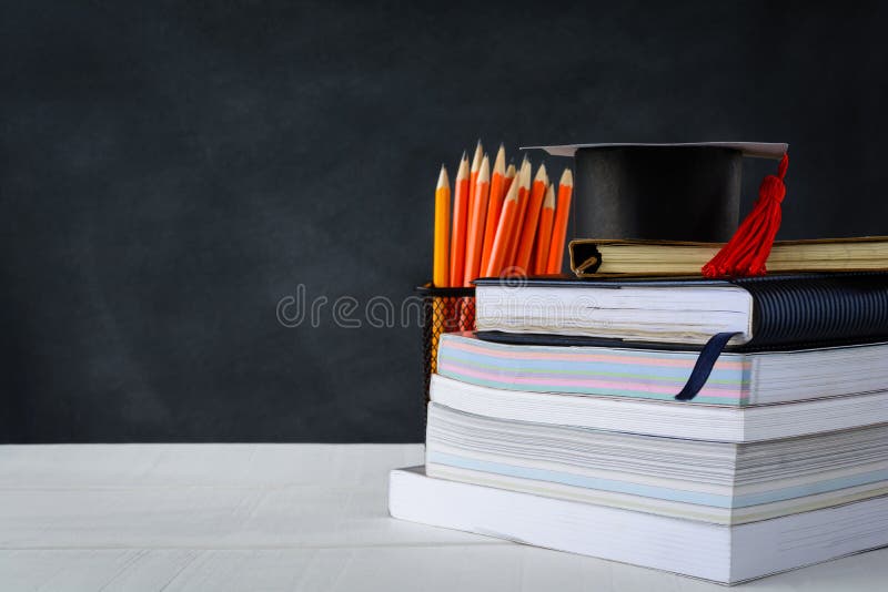 Book and Pencil on White Table Black Board Background with Study Stock ...