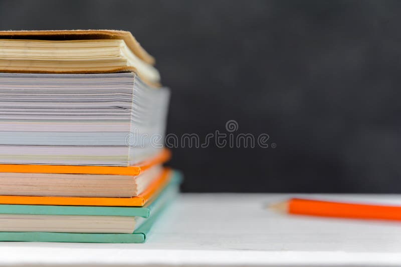 Book and Pencil on White Table Black Board Background with Study Stock ...