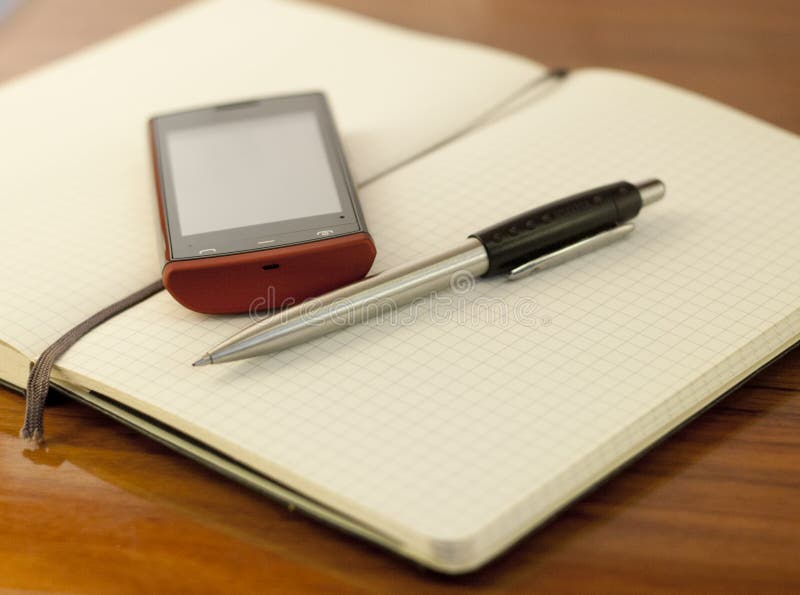 Book, phone and pen stock image. Image of notepad, product - 25915219